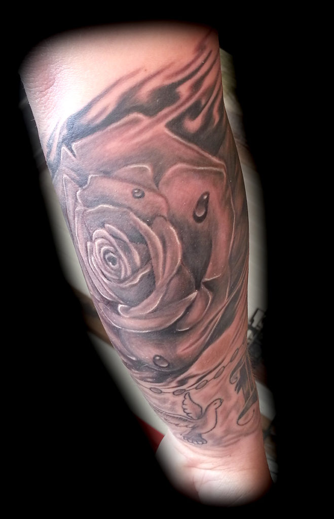 realistic floral tattoo done at Masterpiece Tattoo in San Francisco