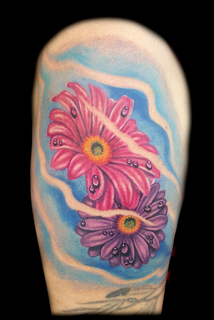 realistic floral tattoo done at Masterpiece Tattoo in San Francisco