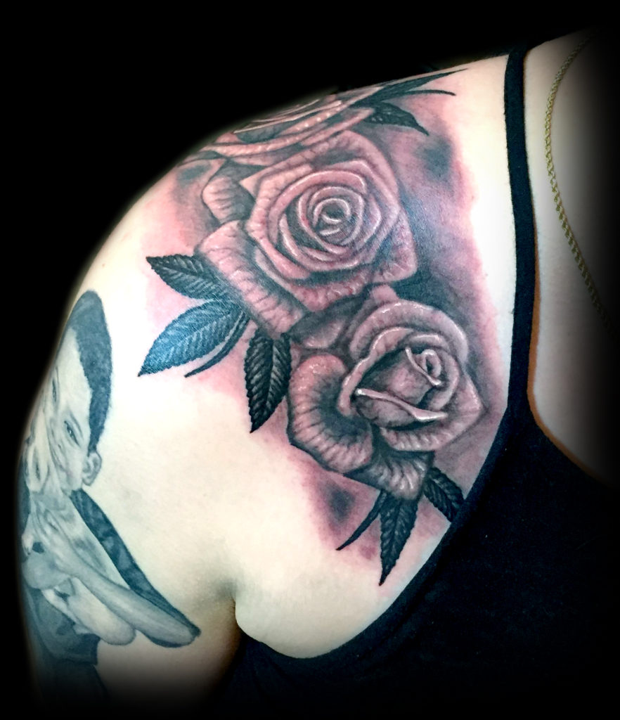 realistic floral tattoo done at Masterpiece Tattoo in San Francisco