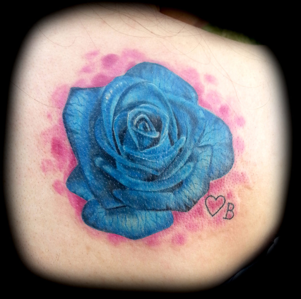 realistic floral tattoo done at Masterpiece Tattoo in San Francisco