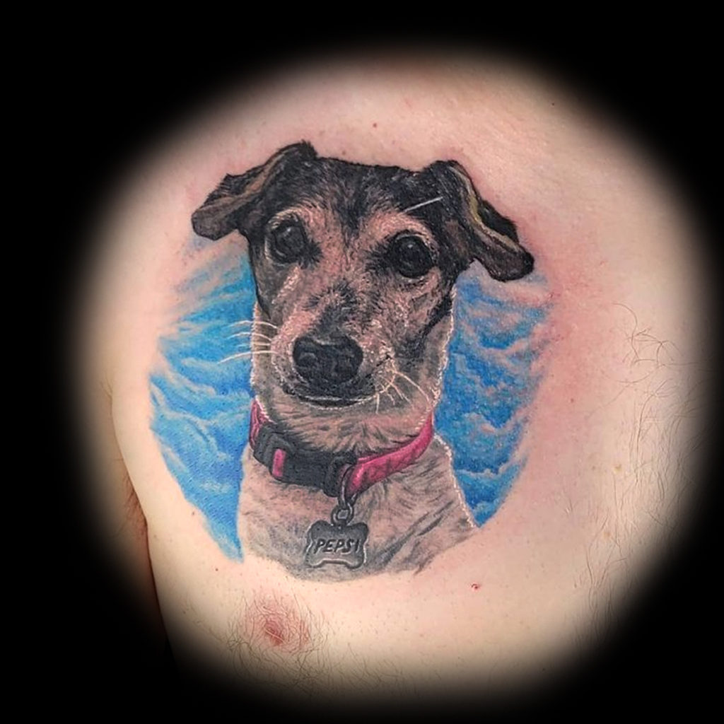 realistic dog tattoos done by Brian Martinez at Masterpiece Tattoo
