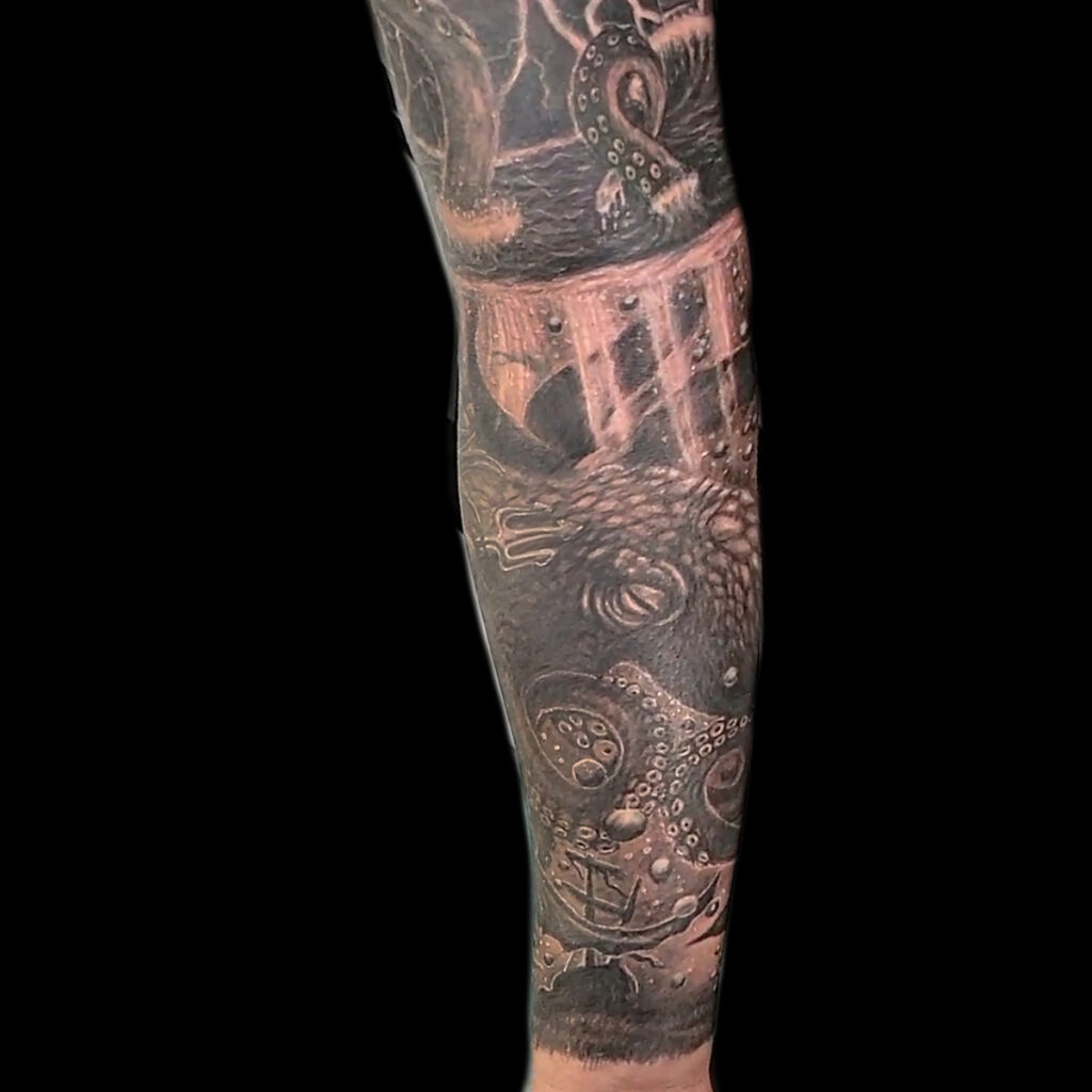 realistic 3d octopus tattoo done at Masterpiece Tattoo